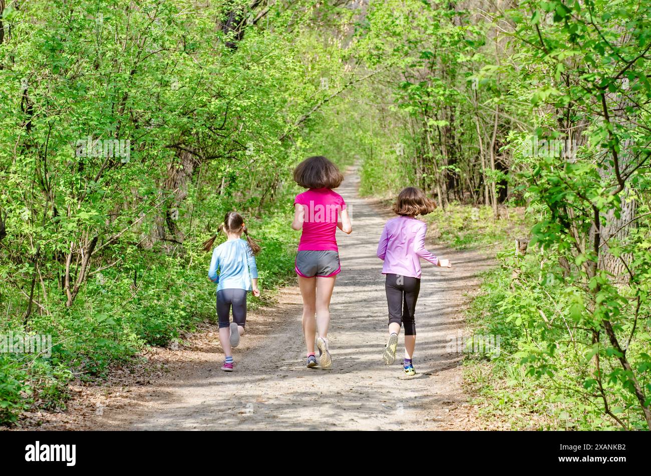 Family running, happy active mother and kids jogging outdoors, run with ...