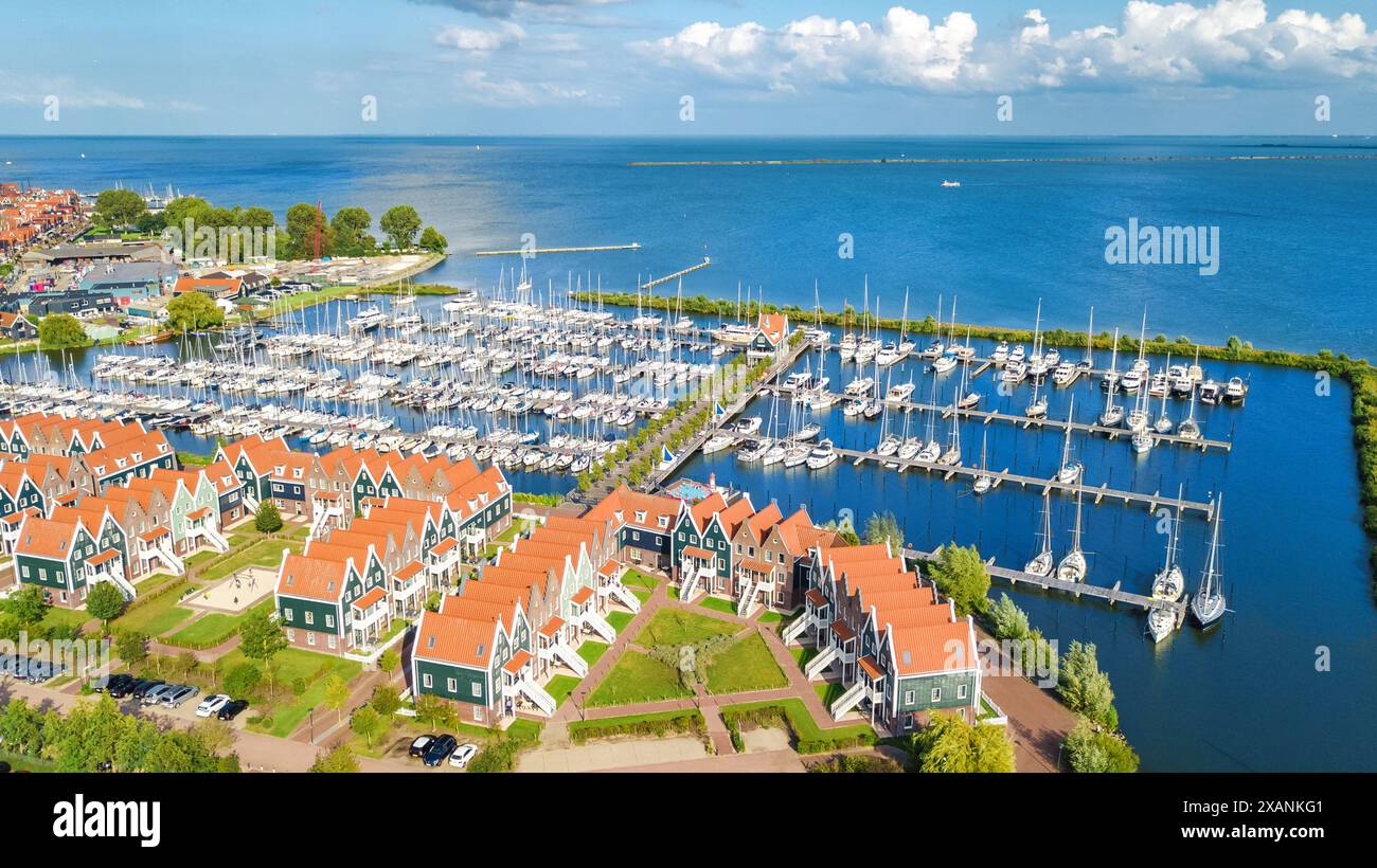 Aerial drone view of typical modern Dutch houses and marina in harbor ...