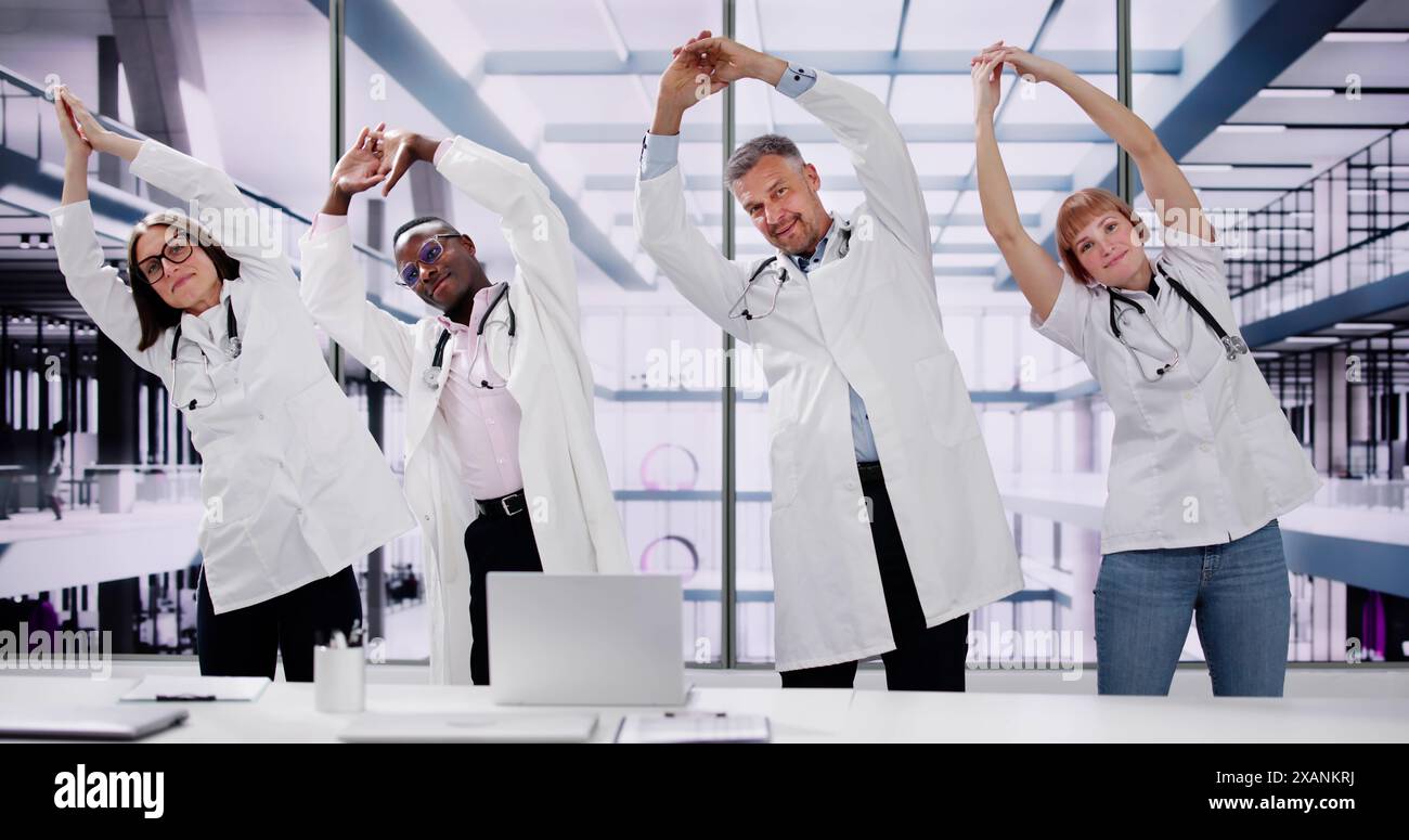 Fitness Stretch Exercise Workout For Group Of Doctors Stock Photo - Alamy