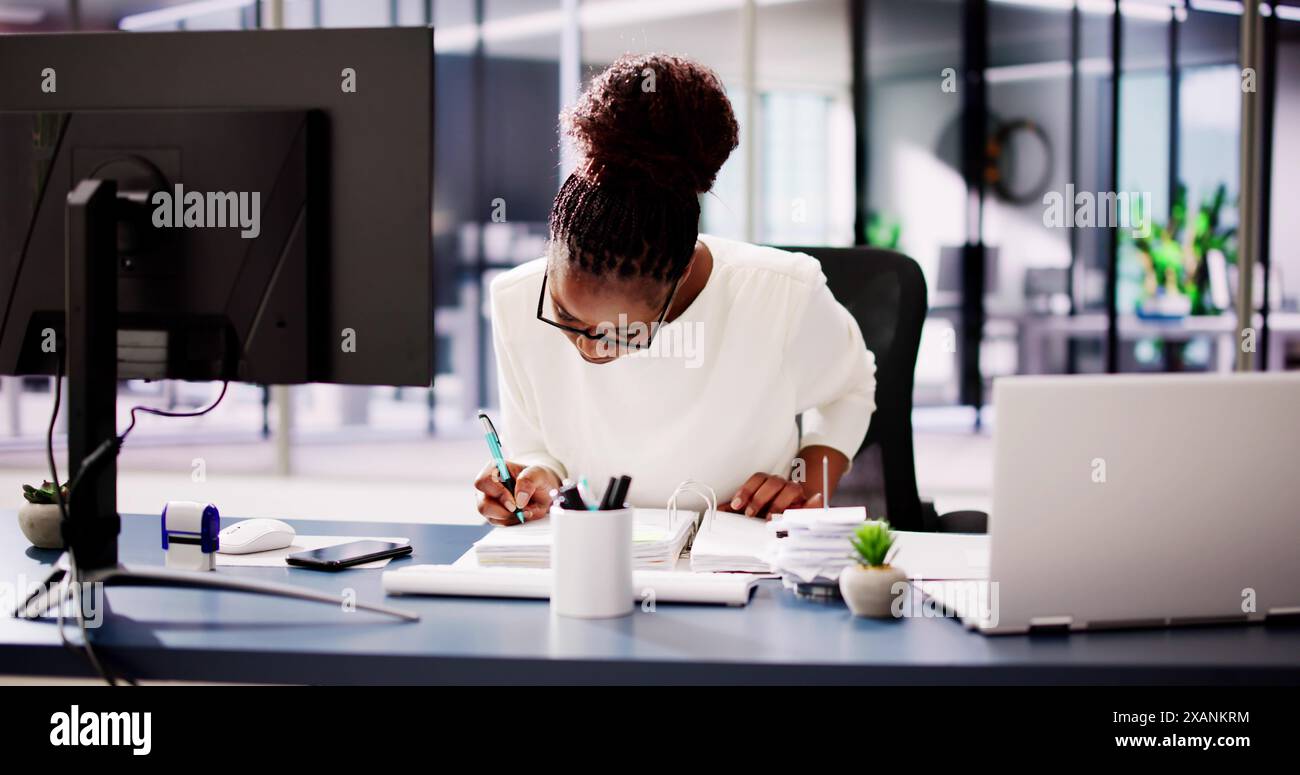 Successful African American Accountant Woman Smiling While Using ...