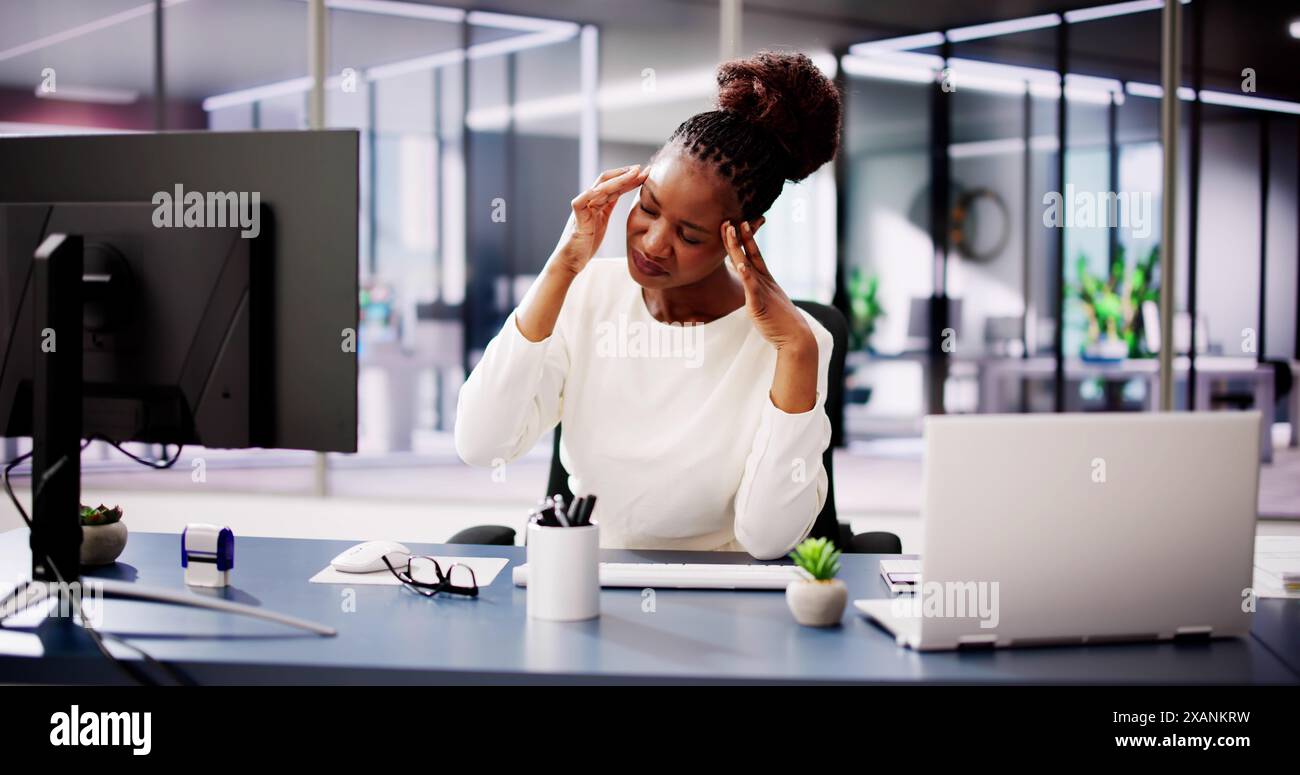 Exhausted Businesswoman Working on Computer in Office, Fighting Stress ...
