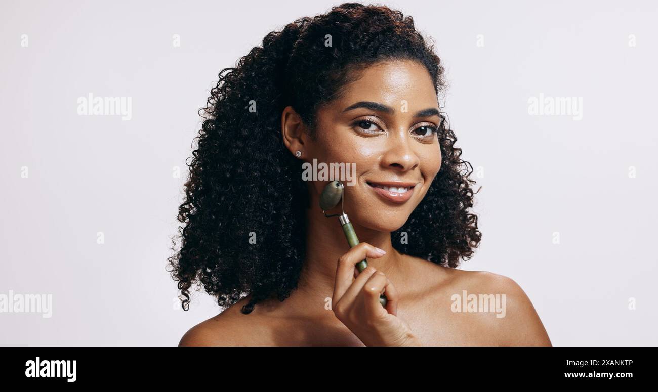 Jade roller, portrait and woman with cosmetics, wellness and grooming ...