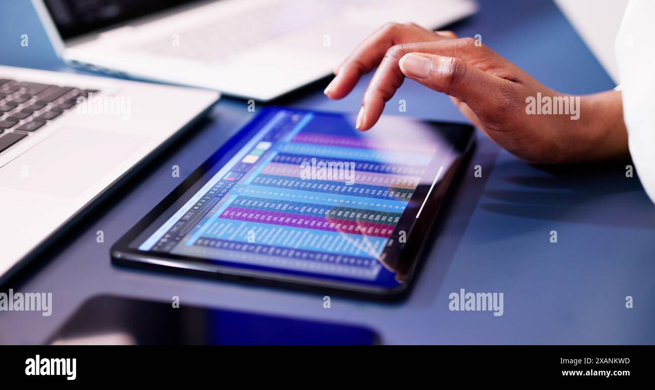 Analyzing Financial Charts on a Tablet in the Workplace: An African American Data Analyst ...