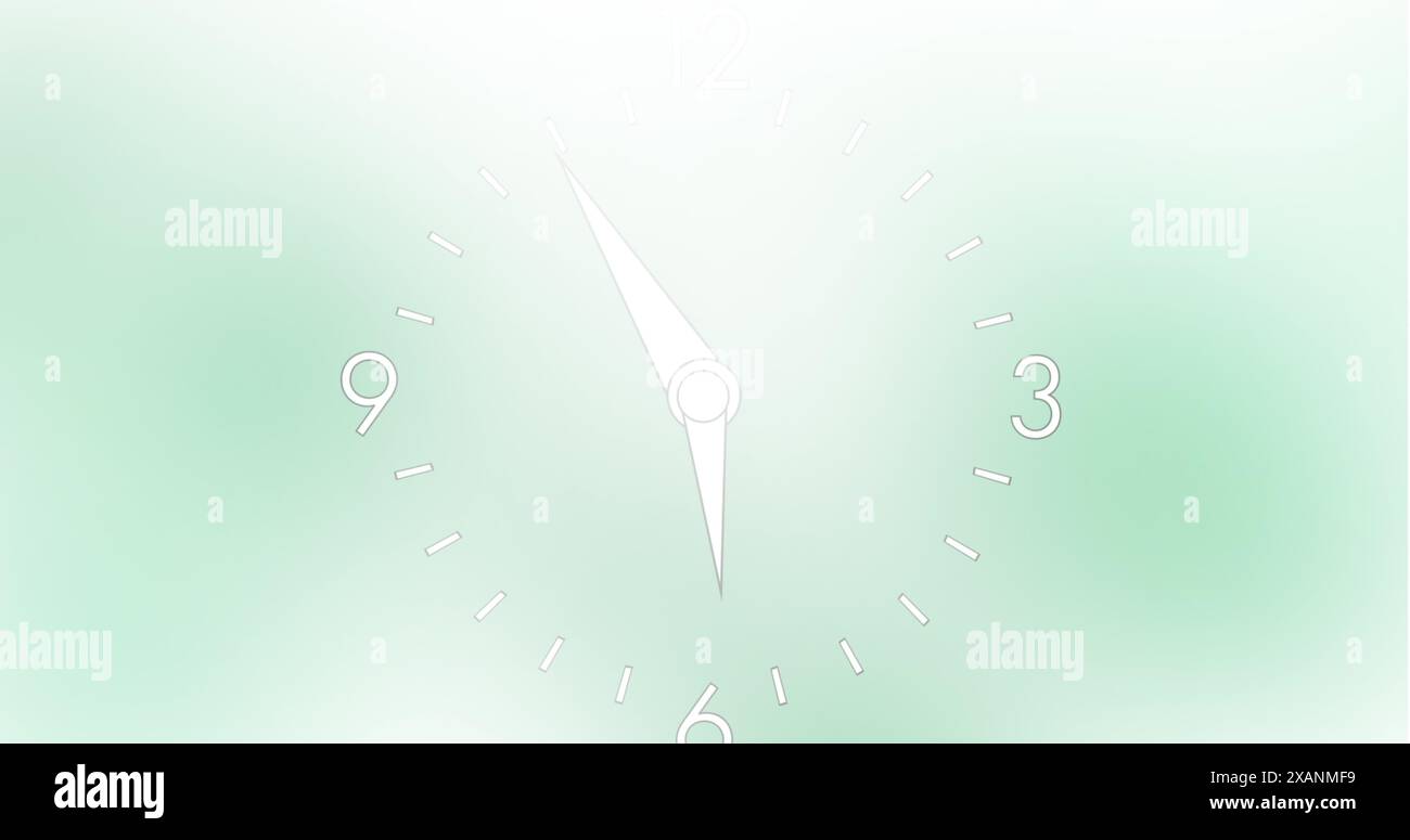 Clock with white hands and numbers on soft green background showing 10: ...
