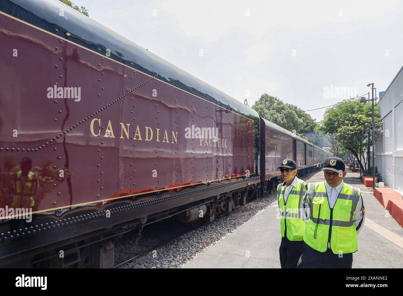 Final Spike Steam Tour police officers walk next to the Empress 2816 ...