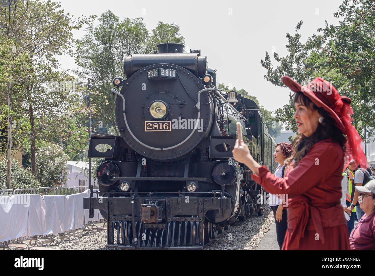 Final Spike Steam Tour A woman wearing a dress from the 1930s. is seen ...