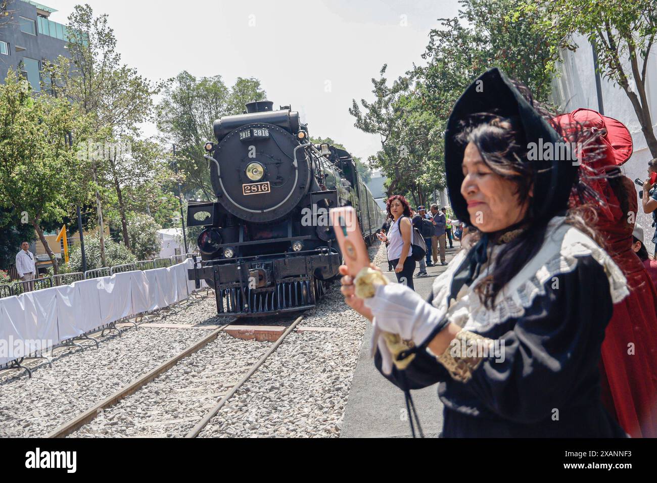 Final Spike Steam Tour A woman wearing a dress from the 1930s. is seen ...