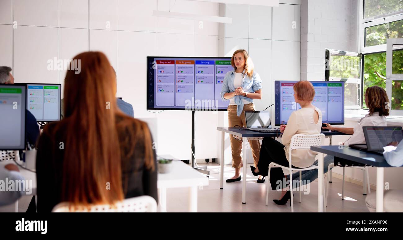 Corporate Training In A Black Classroom With Computer Background Stock ...