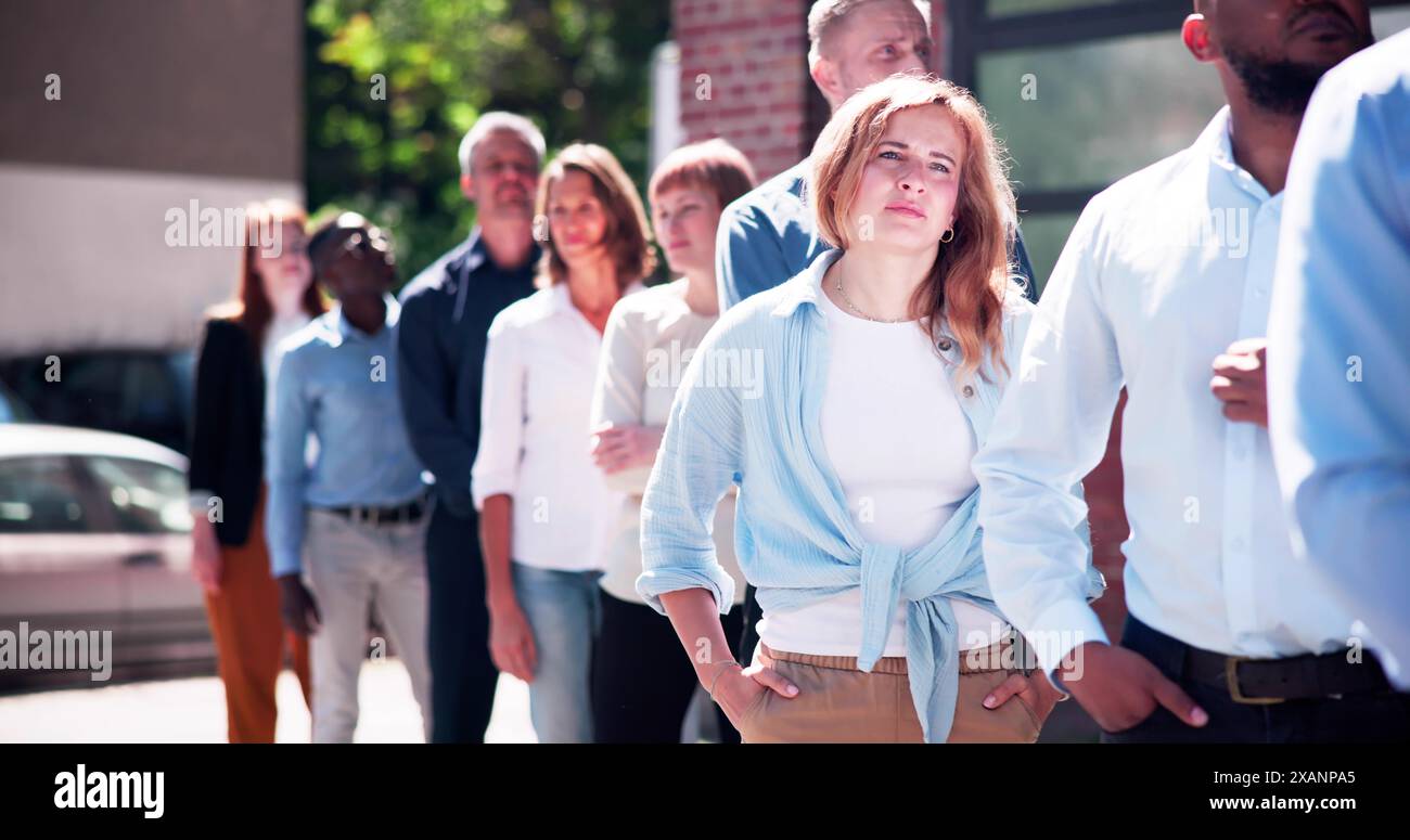 Queue Outdoors. Business People Waiting In Line Stock Photo - Alamy