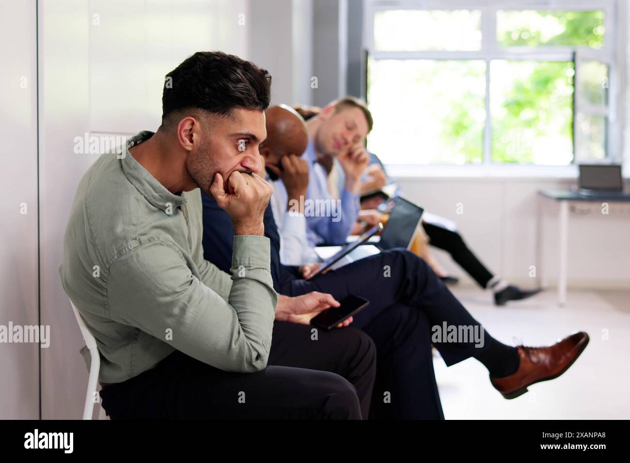 Job interview queue people in room wait line hi-res stock photography ...