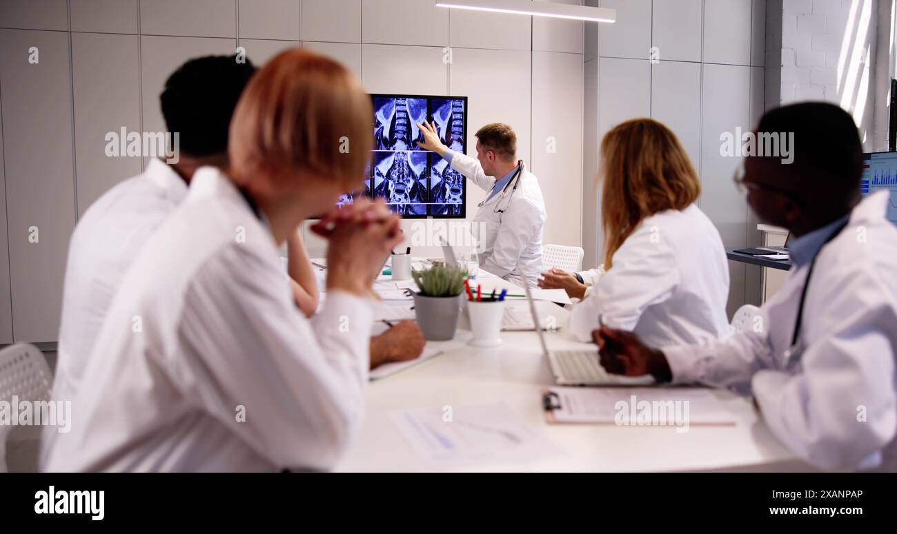 Diverse Doctors Team Looking At MRT Scans Stock Photo - Alamy