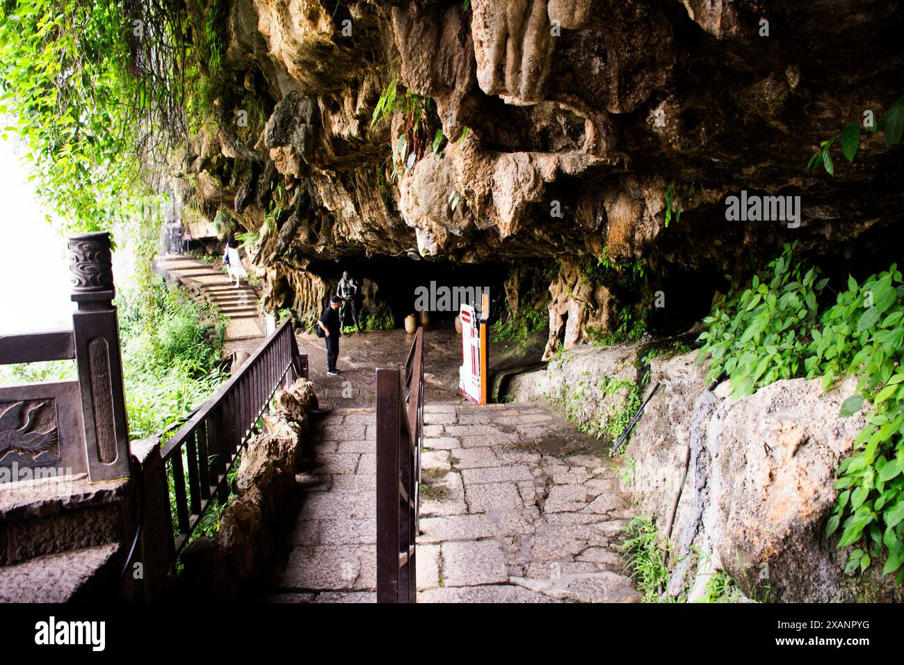 Chinese people and foreign traveler walking underwater falls travel ...