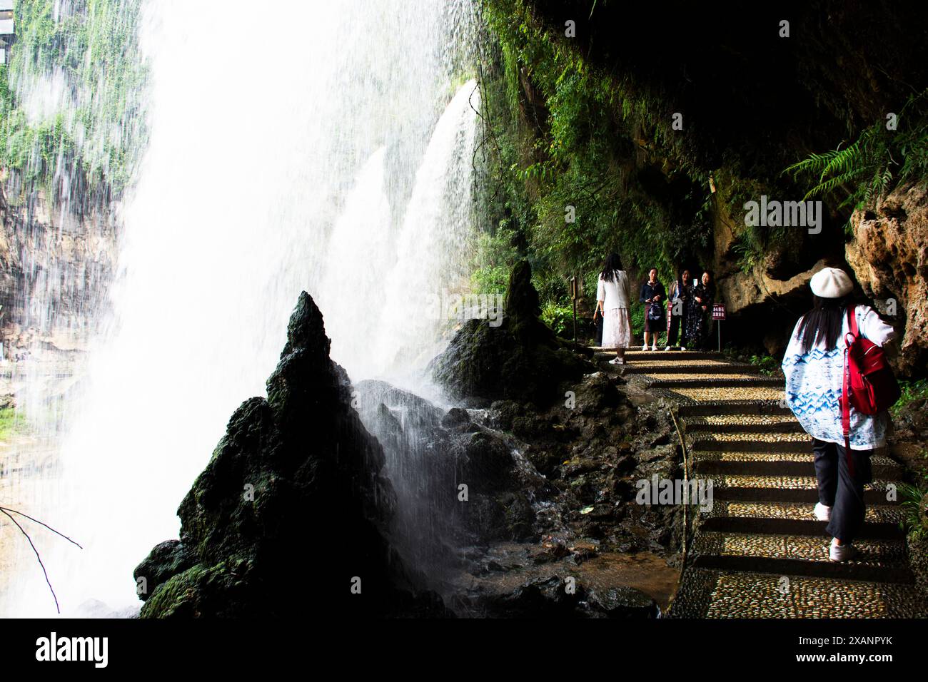 Chinese people foreign travelers walking underwater falls travel visit ...