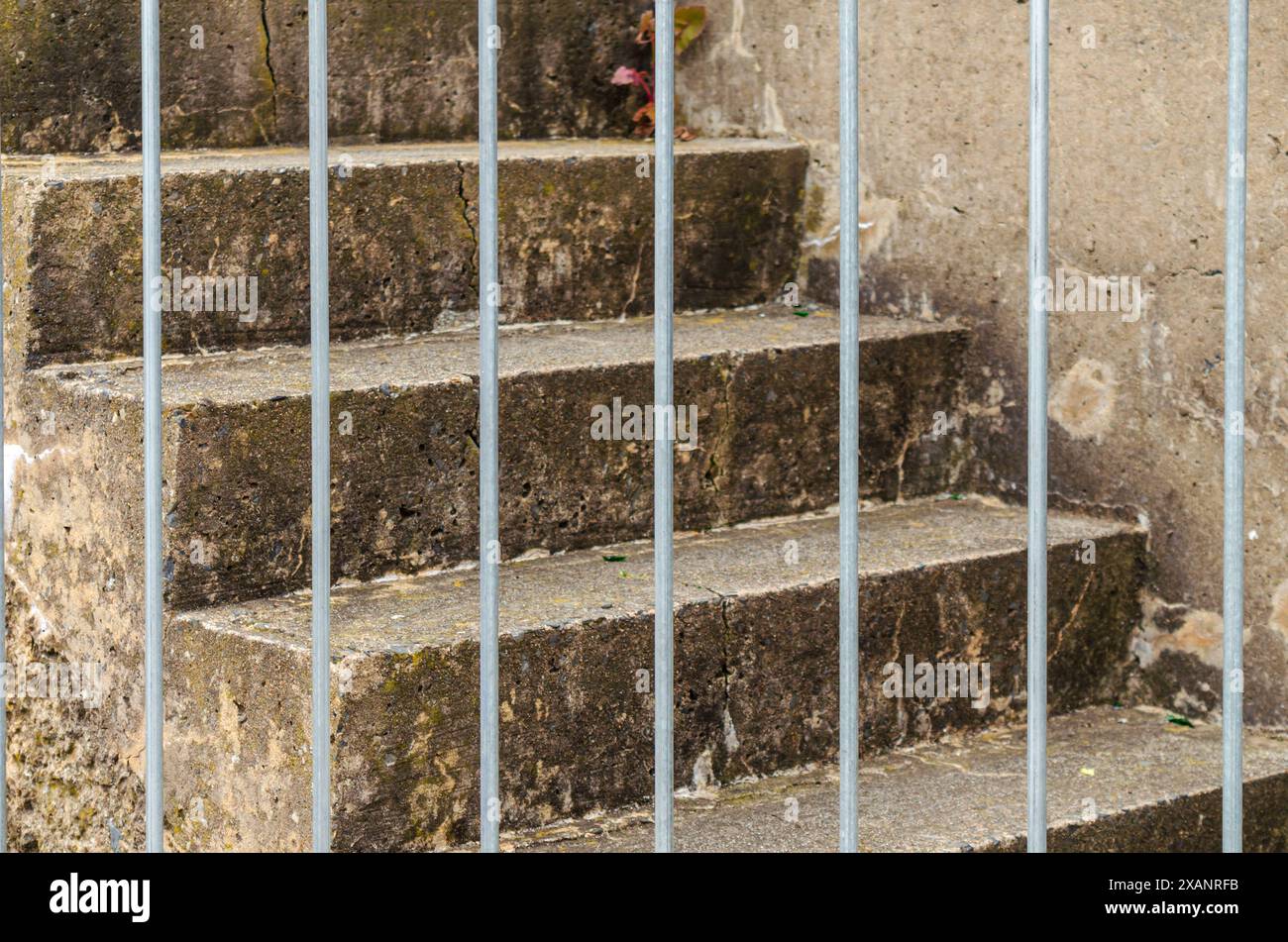 Stone steps fenced off with a metal safety barrier for public safety ...