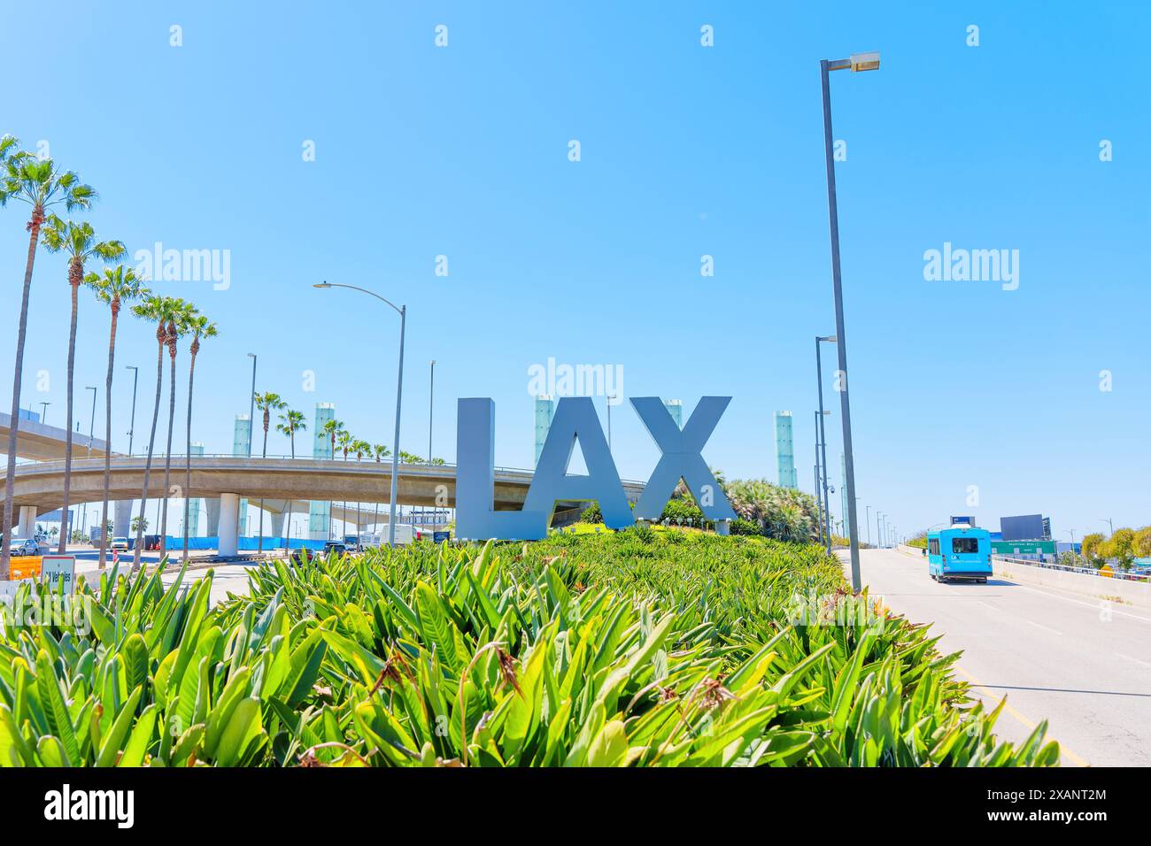 Los Angeles, California - April 8, 2024: LAX sign, lush greenery and ...