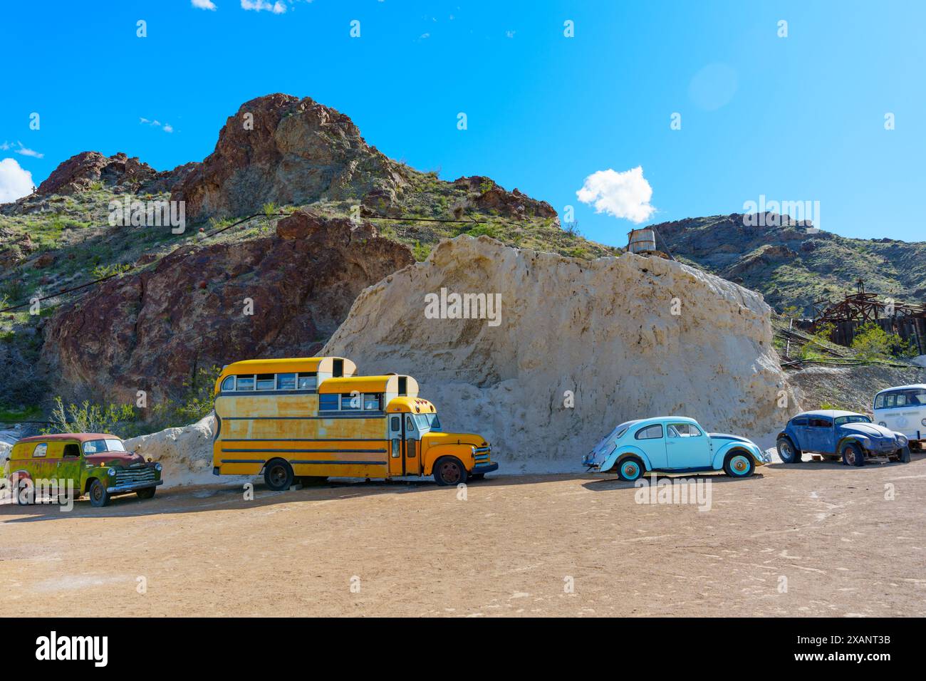 Nelson, Nevada - April 15, 2024: Vintage yellow school bus and some rusty classic cars parked ...