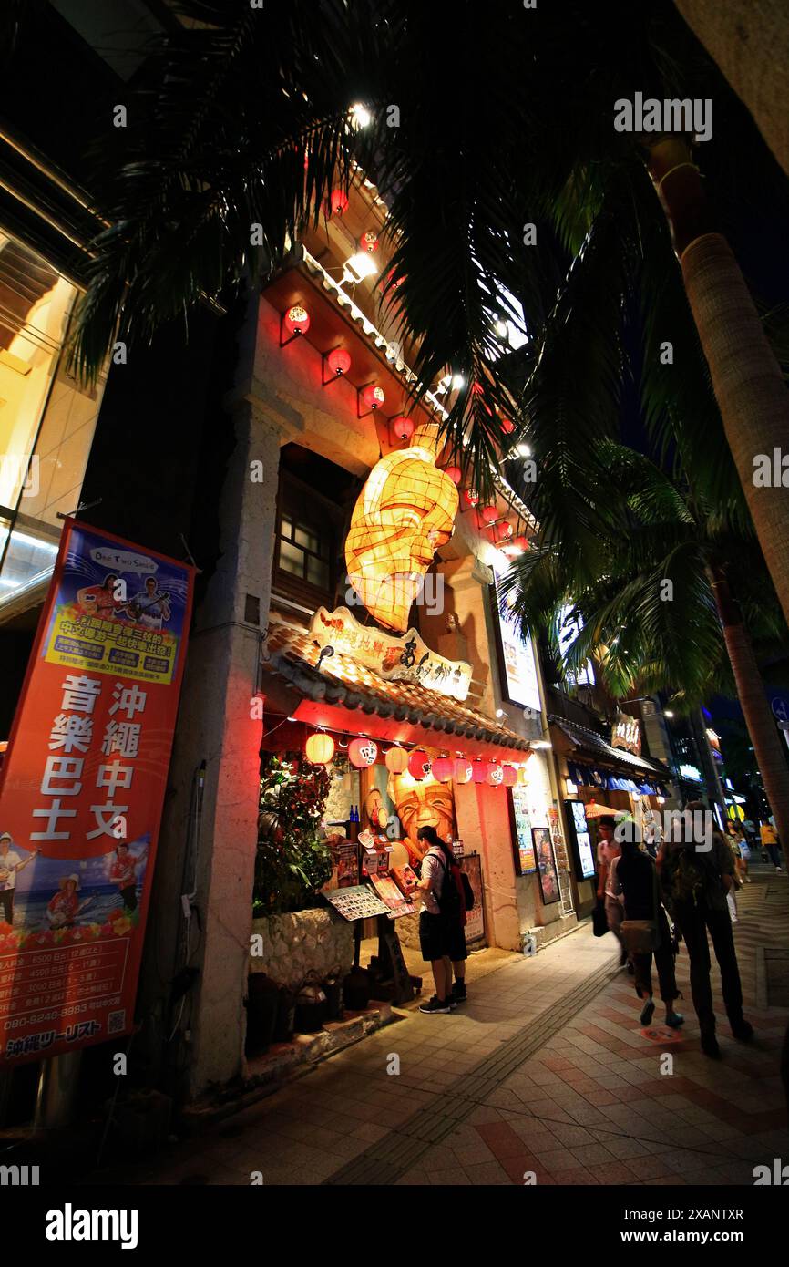 Japanese scenery Kokusai-dori shopping street in Naha city at dusk ...