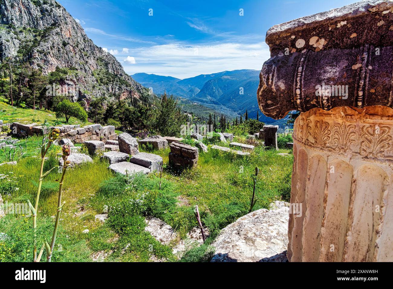 Ancient Greek column at the Delphi archaeological site. Delphi was ...