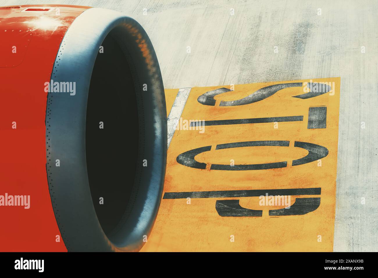 Large airplane engine with a sign that says stop Stock Photo - Alamy