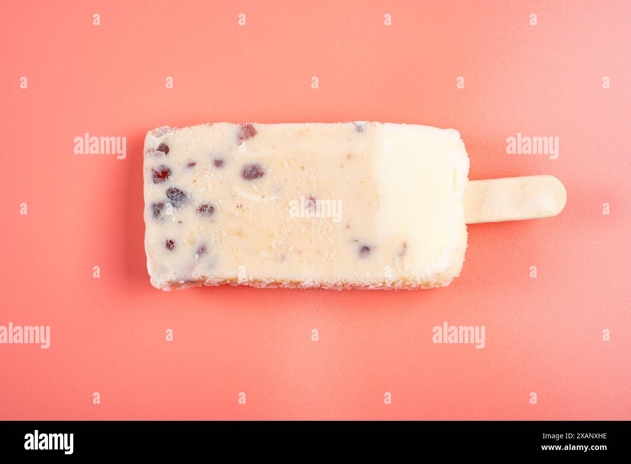 top view milkshake flavor popsicle with red beans on pink background ...