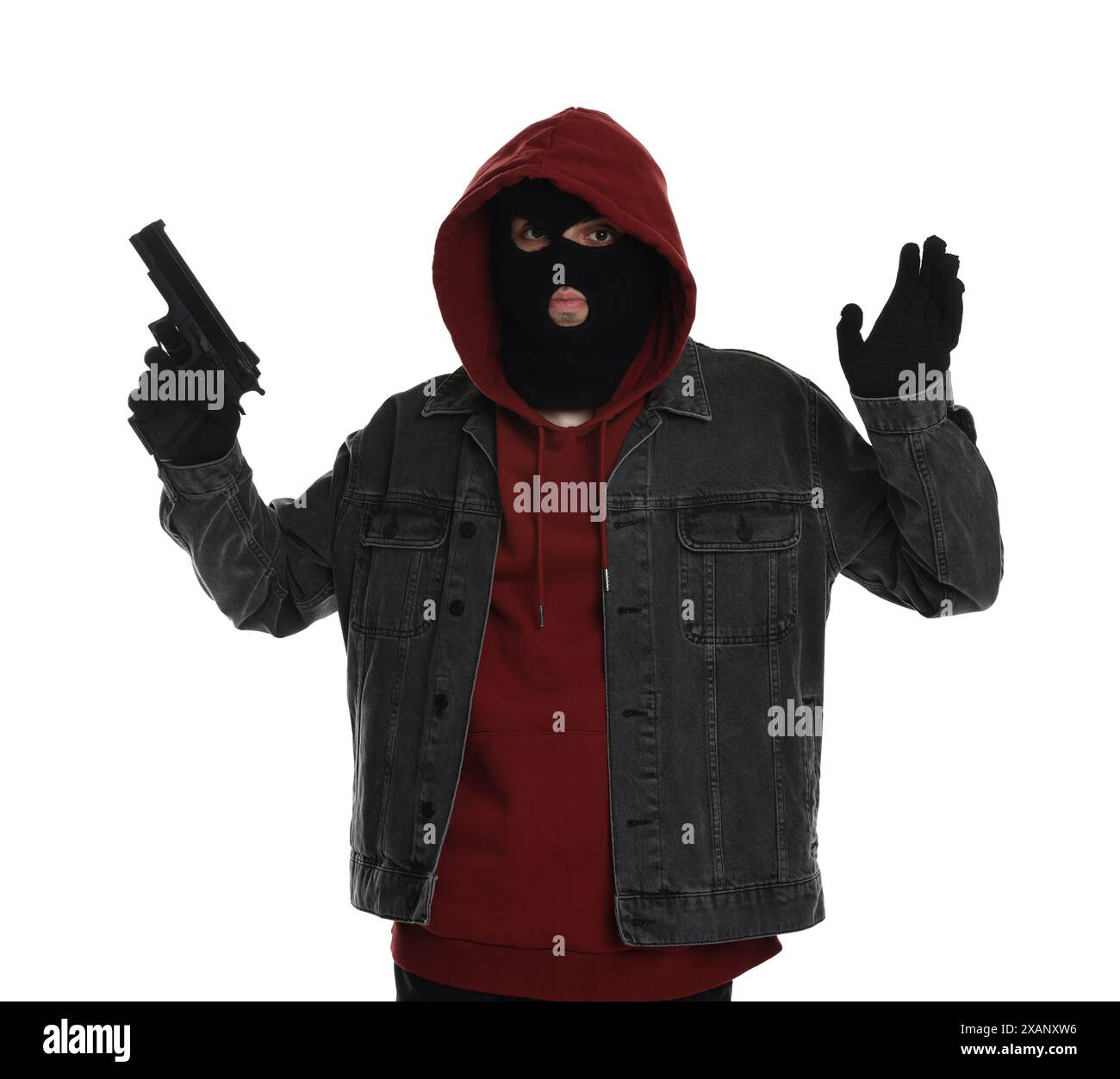 Thief in balaclava raising hands with gun on white background Stock ...