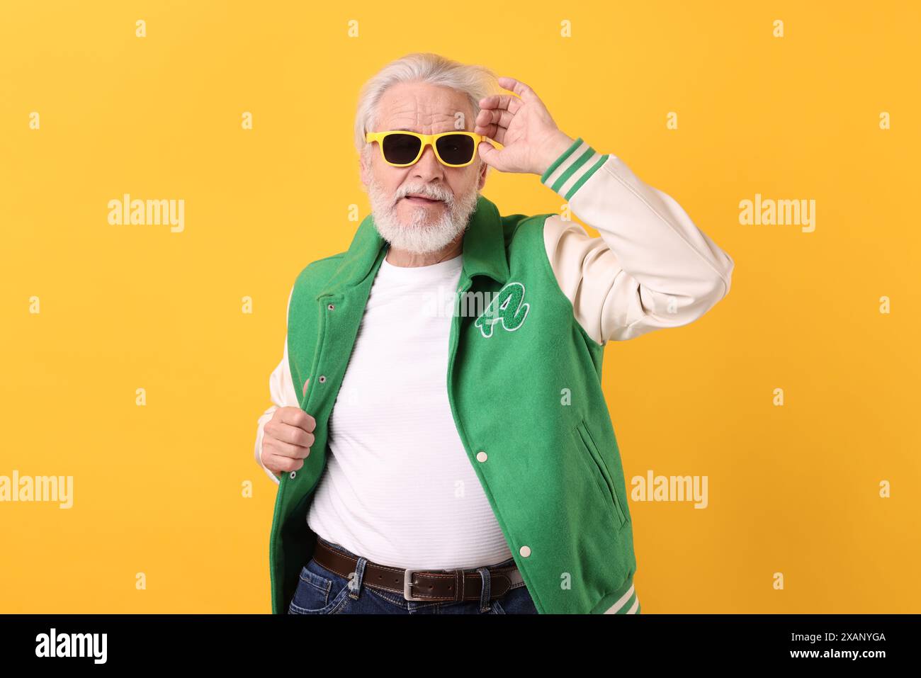 Portrait of grandpa with stylish sunglasses on yellow background Stock ...