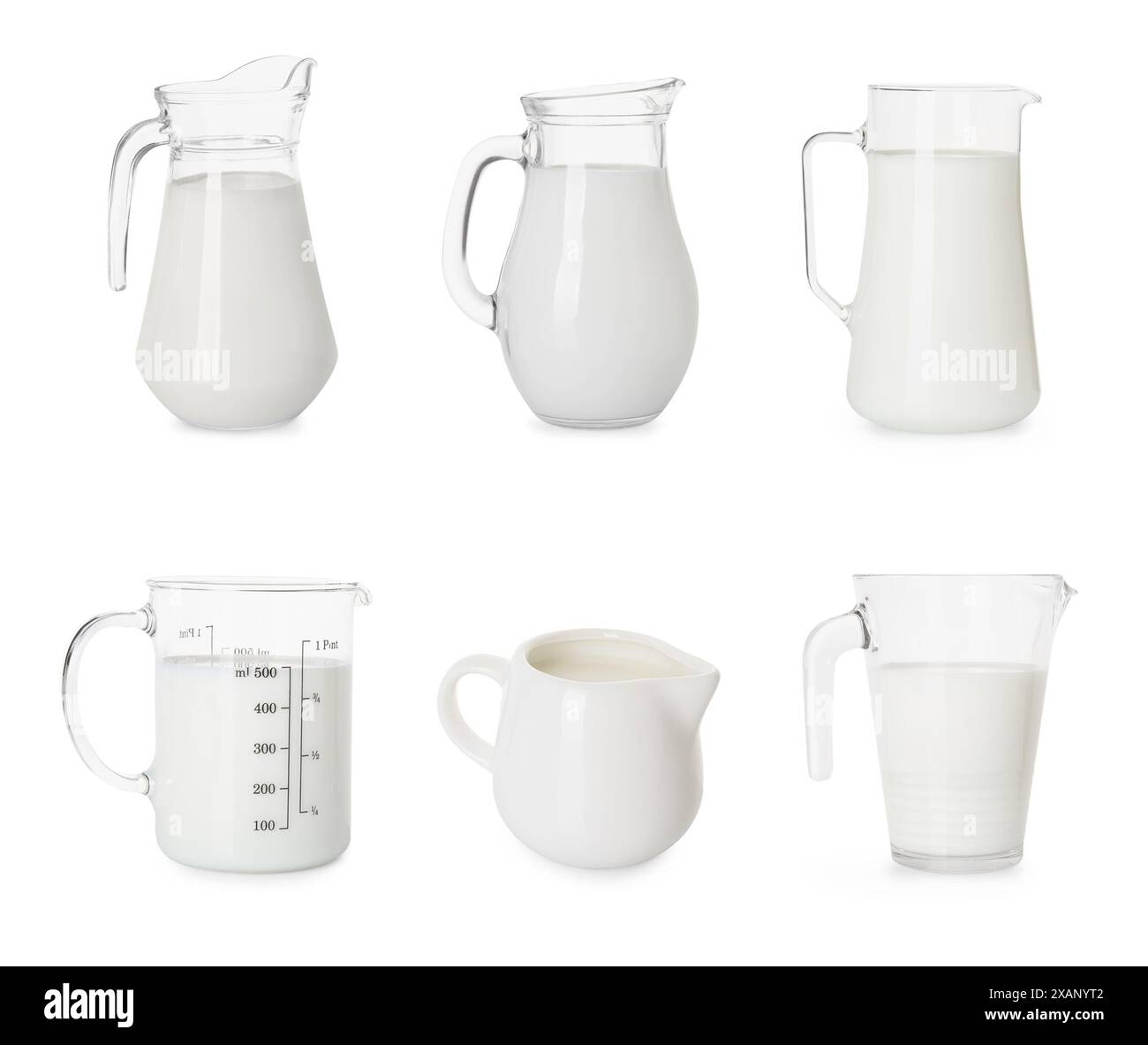Fresh milk in jugs isolated on white, set Stock Photo - Alamy