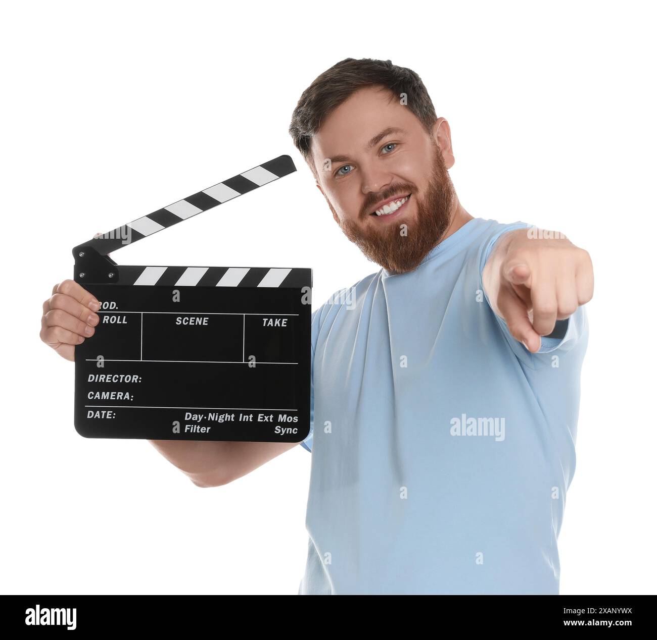 Making movie. Smiling man with clapperboard pointing at camera on white ...