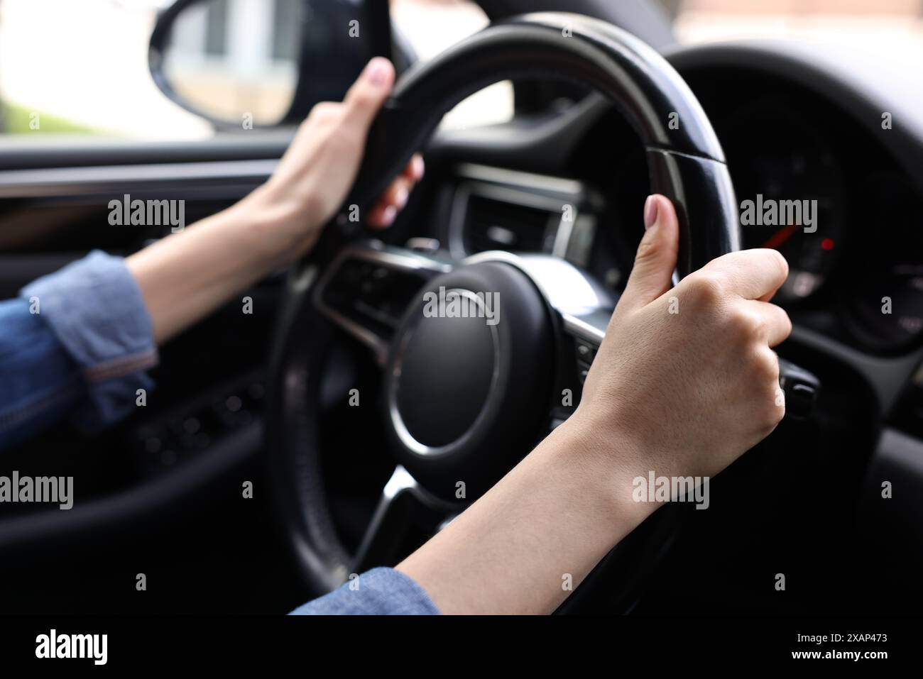 Closeup hand holding car steering hi-res stock photography and images ...
