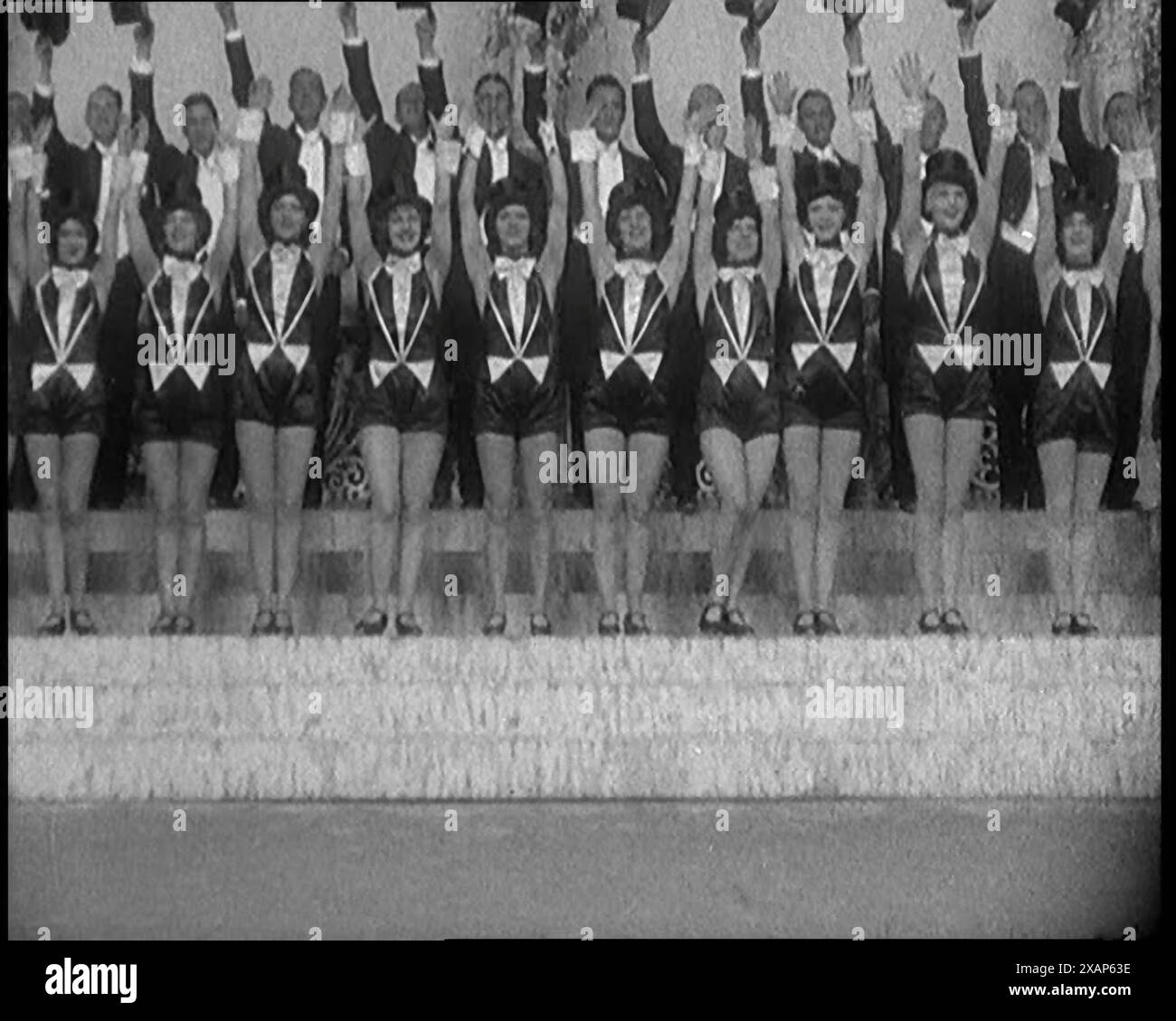 Scene from a Stage Show: a Large Dance Troop Tap Dancing on Steps in ...