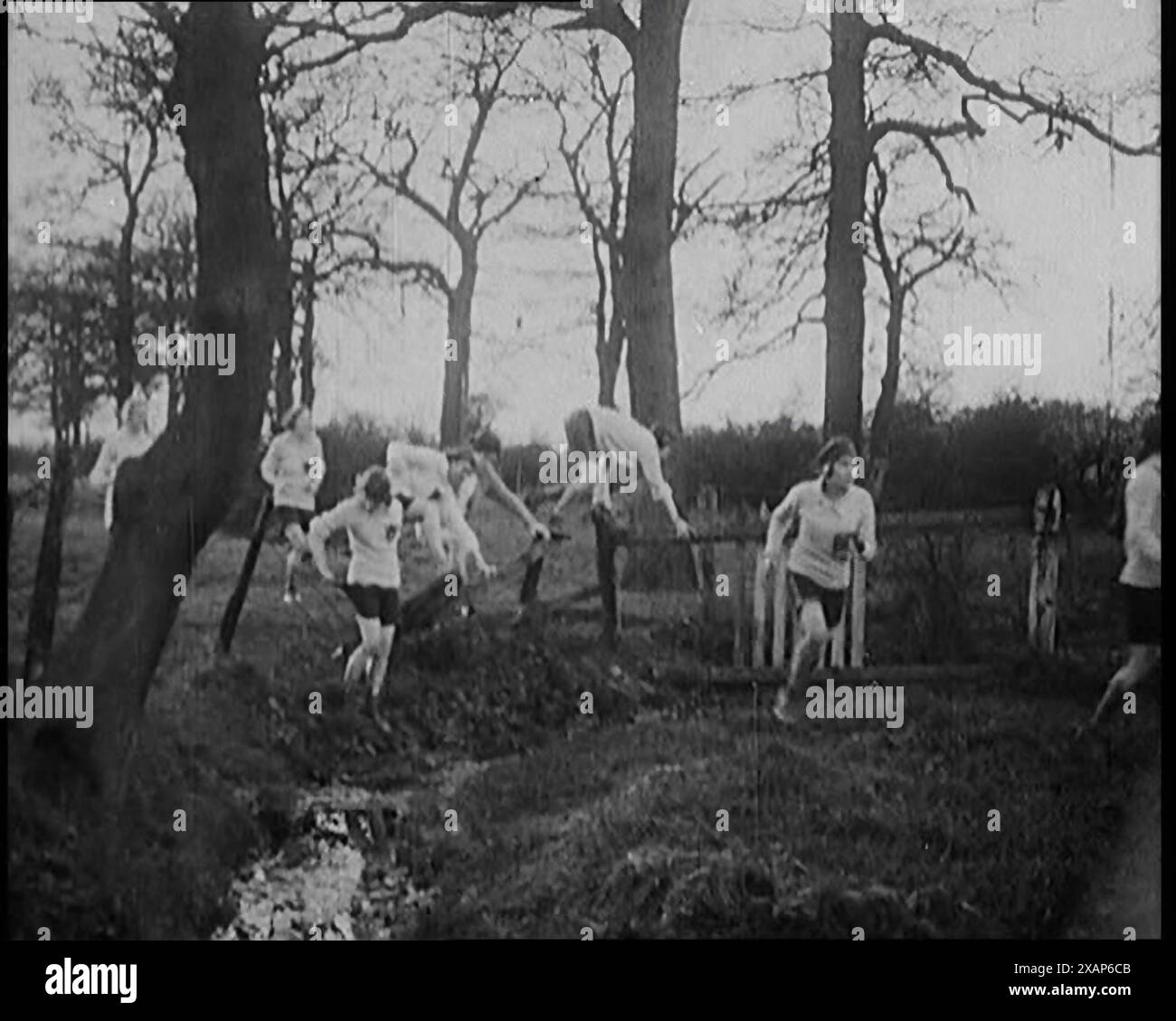 Young Female Civilians Wearing Sport Outfits Running Across a Field ...