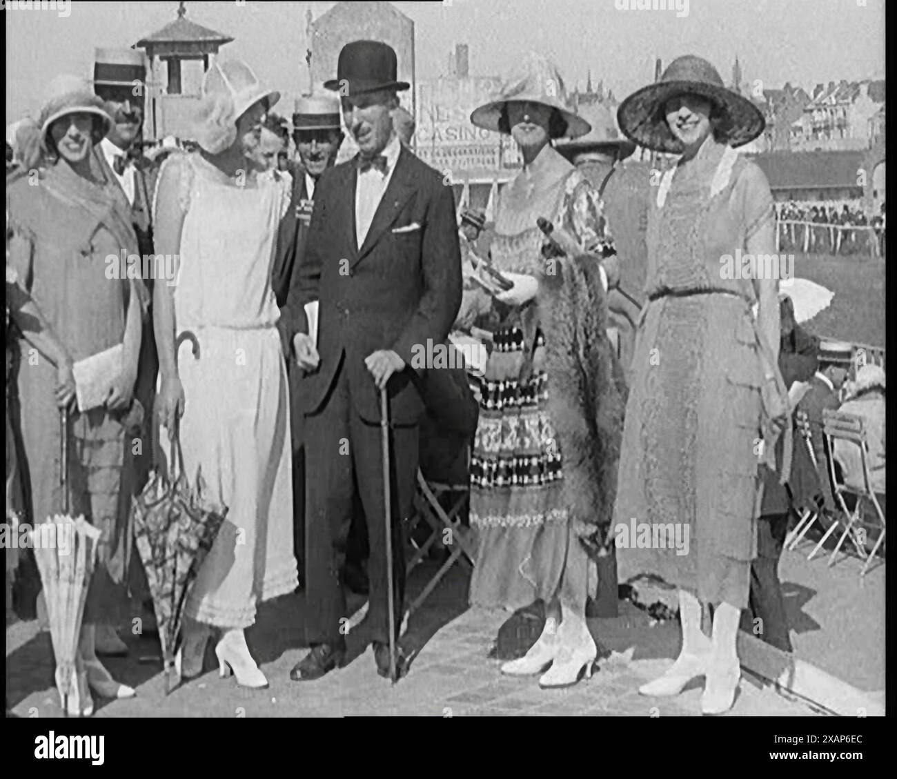 Civilians Wearing Smart Outfits and Hats Posing for the Camera During a ...
