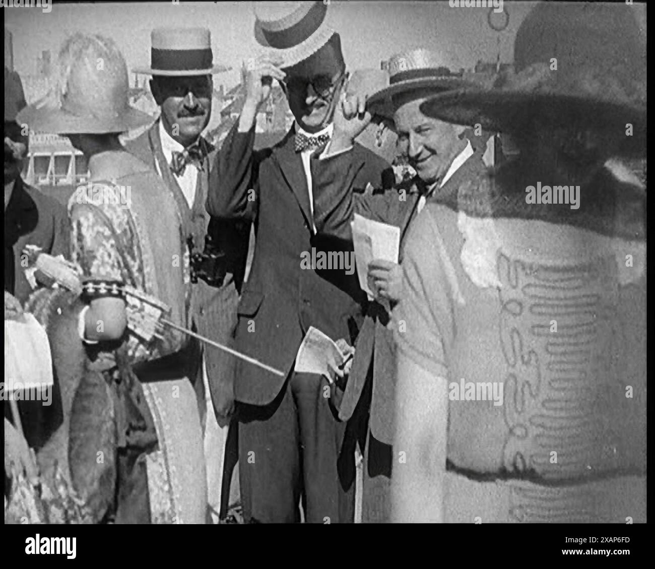 Civilians Wearing Smart Outfits and Hats Posing for the Camera During a ...