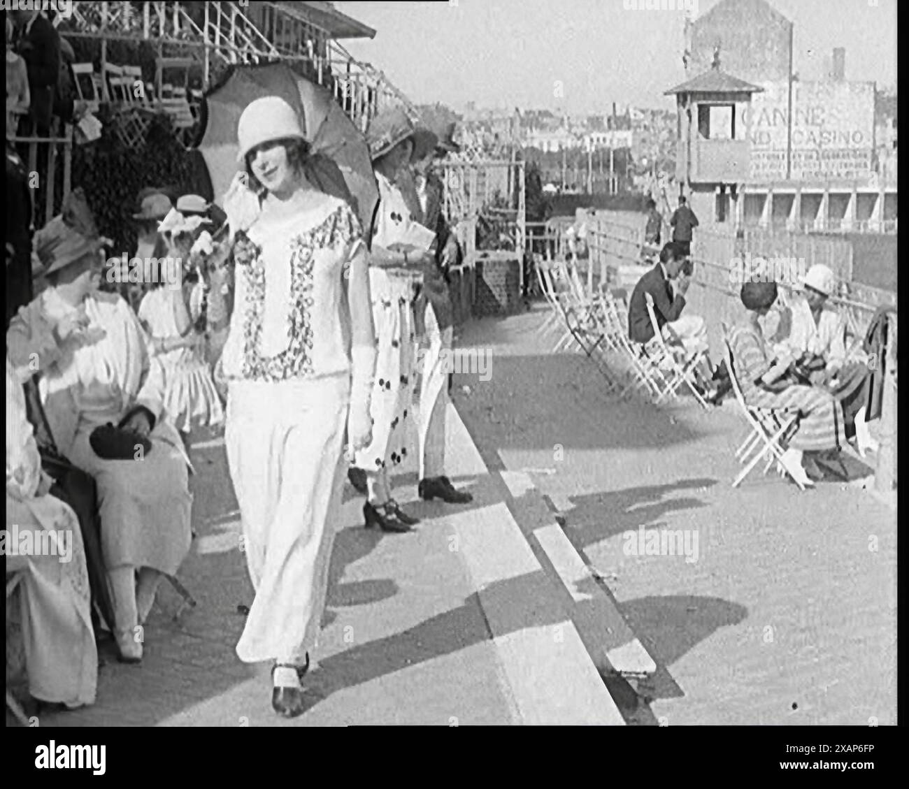 Female Civilian Wearing Smart outfit and Hat Holding a Parasol Walking ...