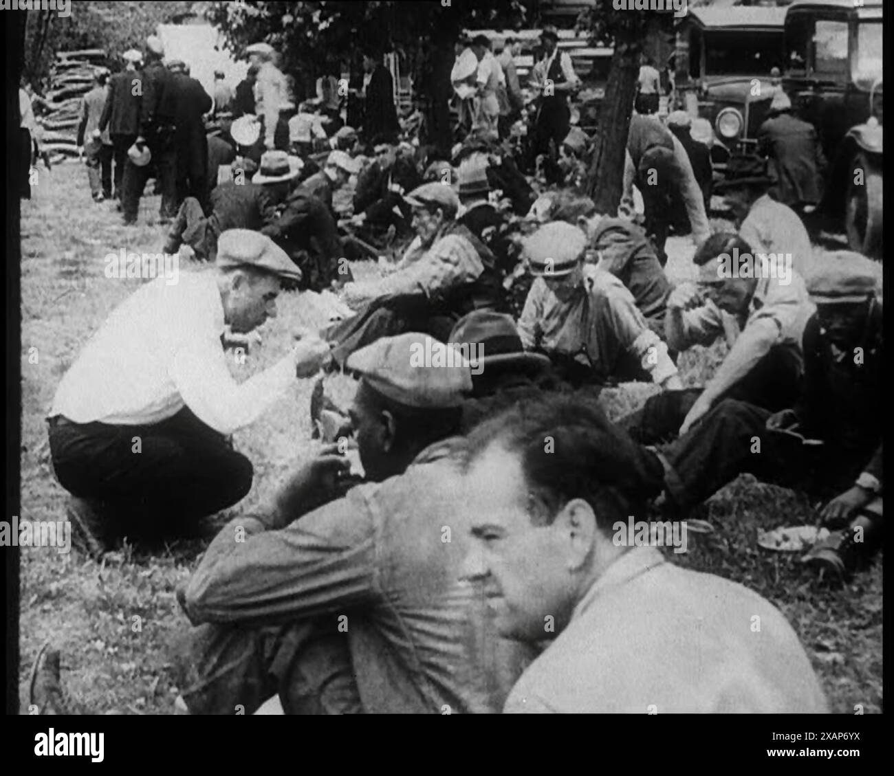 Large Crowd of American Civilians Eating Meals Outdoors, 1930s. '...the ...