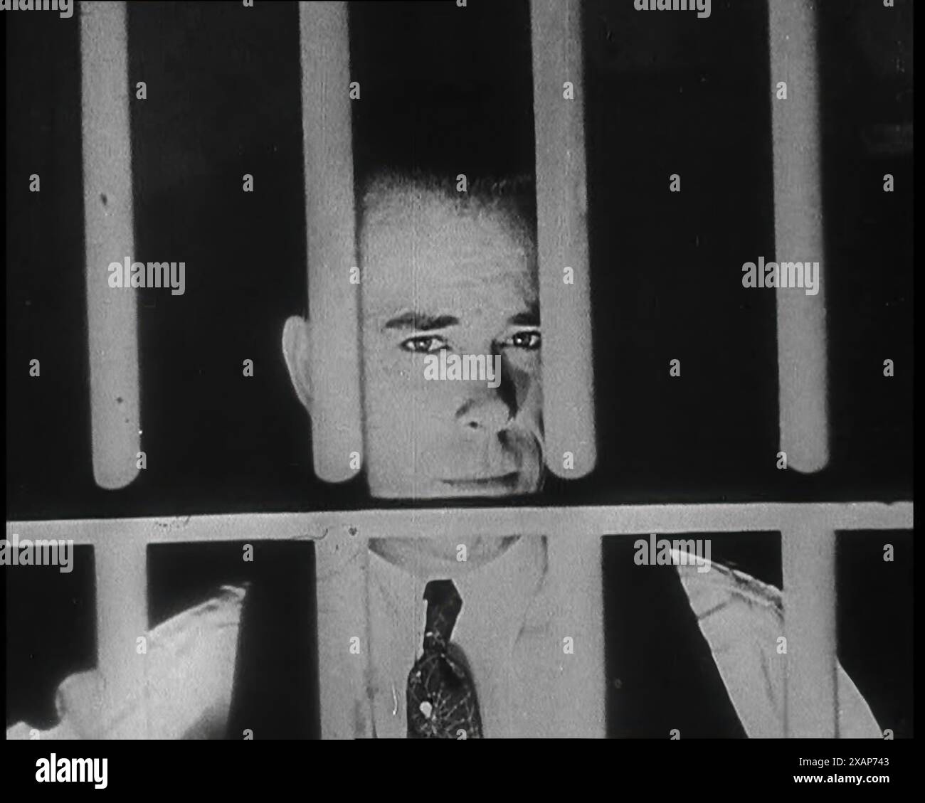 1930's man behind prison bars hi-res stock photography and images - Alamy