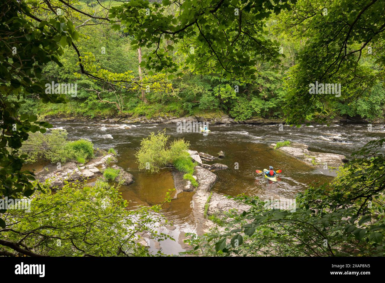 White water canoeing down the River Dee at the Welsh town of Llangollen ...