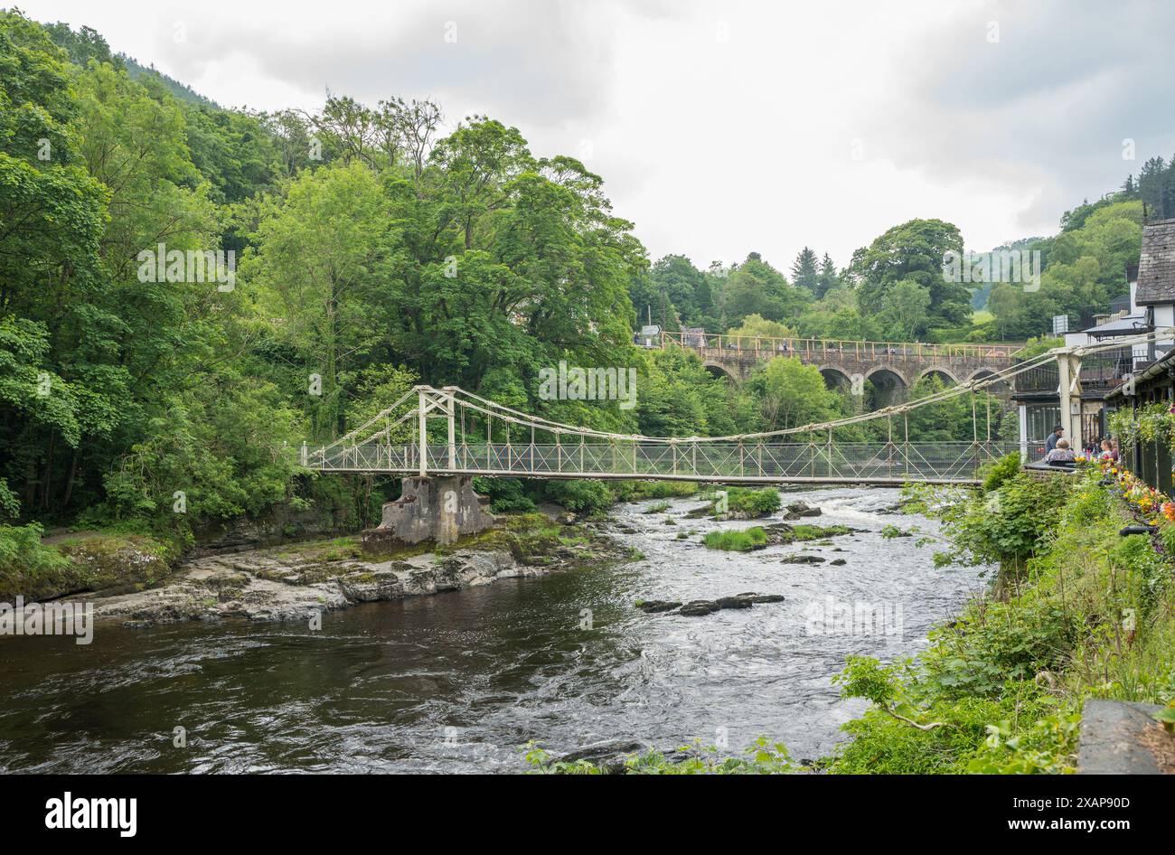 The restored Chain Linked bridge which crosses the River Dee at Berwyn ...