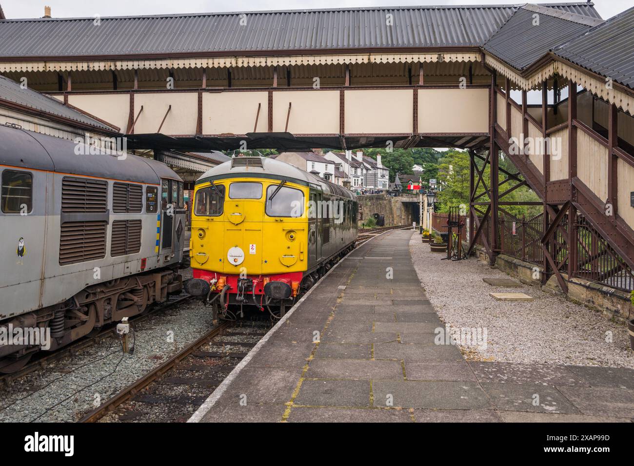A restored Class 26 diesel locomotive with passengers at the Llangollen ...