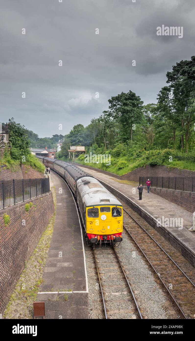 A restored Class 26 diesel locomotive with passengers at the Llangollen ...
