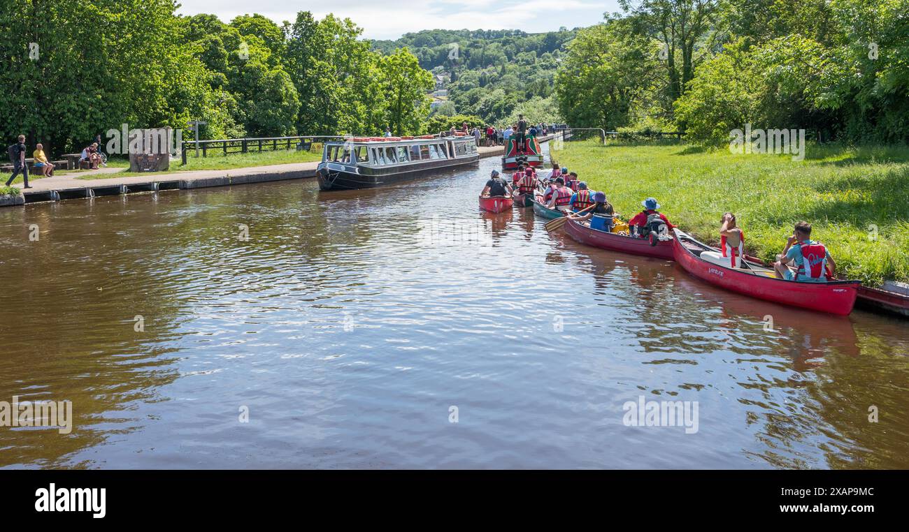 Narrow boats and two man canoes at the Trevor basin on the Llangollen ...