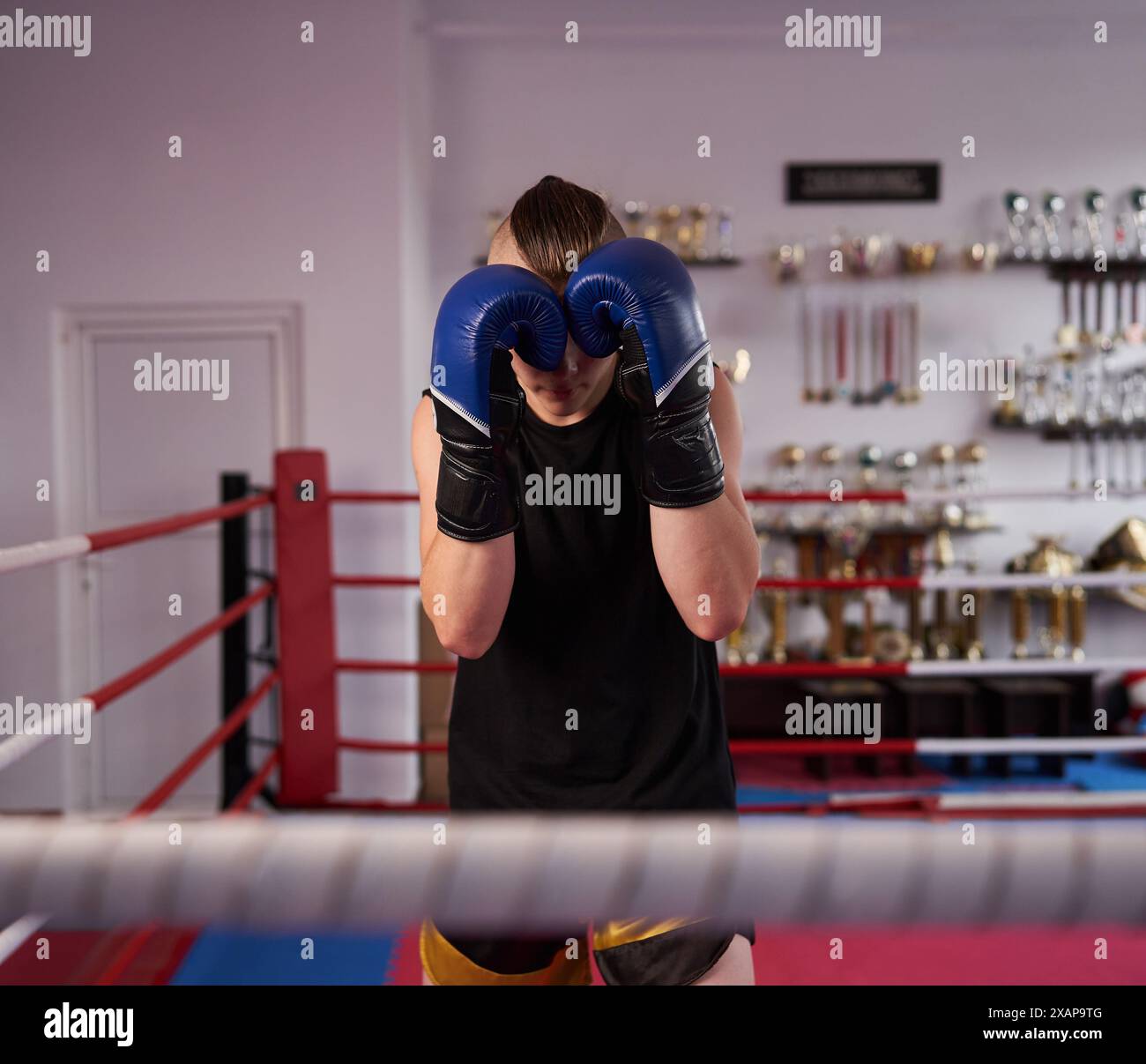 Young teen boxer training by shadow boxing in the ring Stock Photo - Alamy