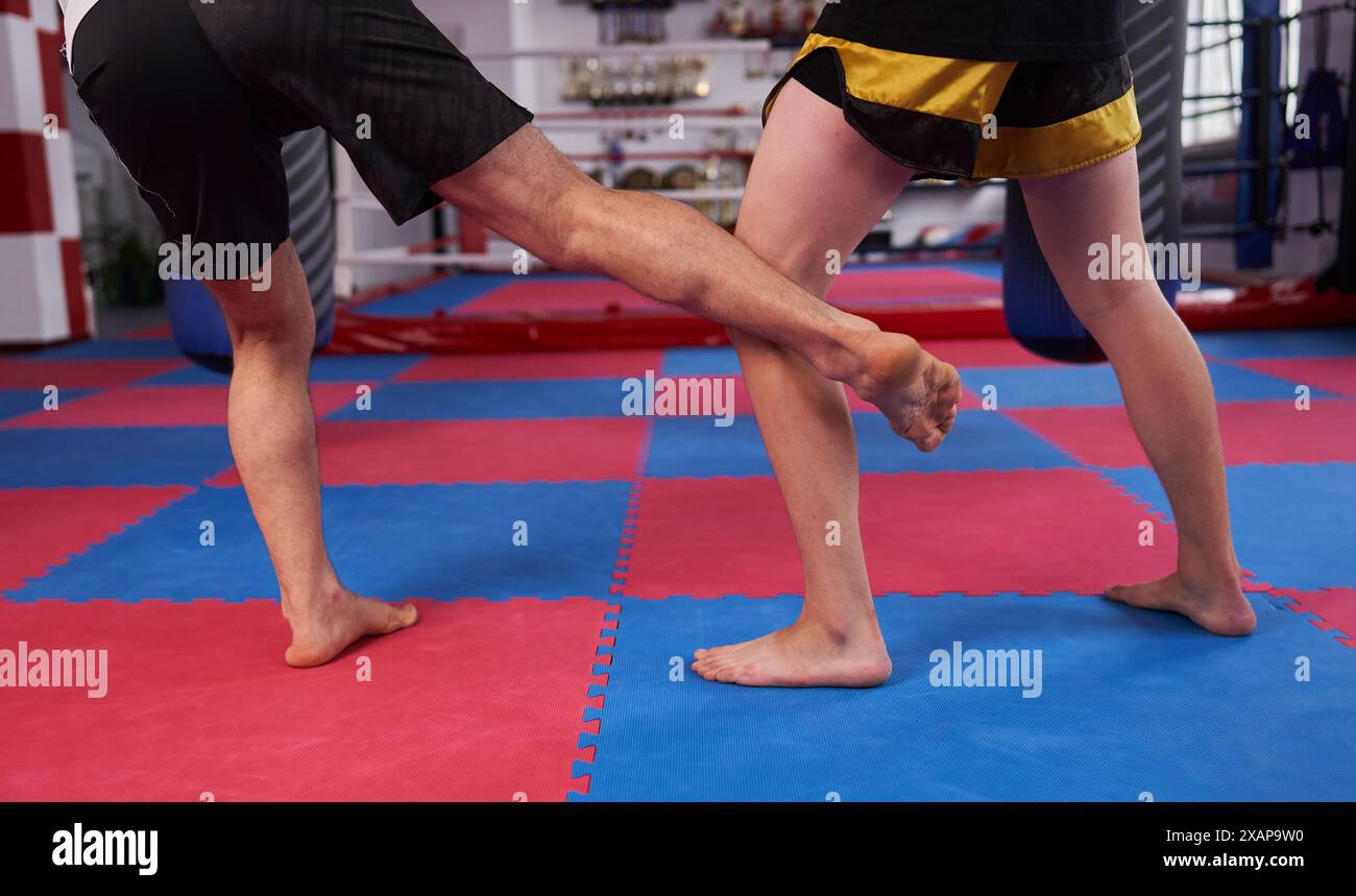 Low kick also called calf kick in muay thay, a painful hit on the leg ...