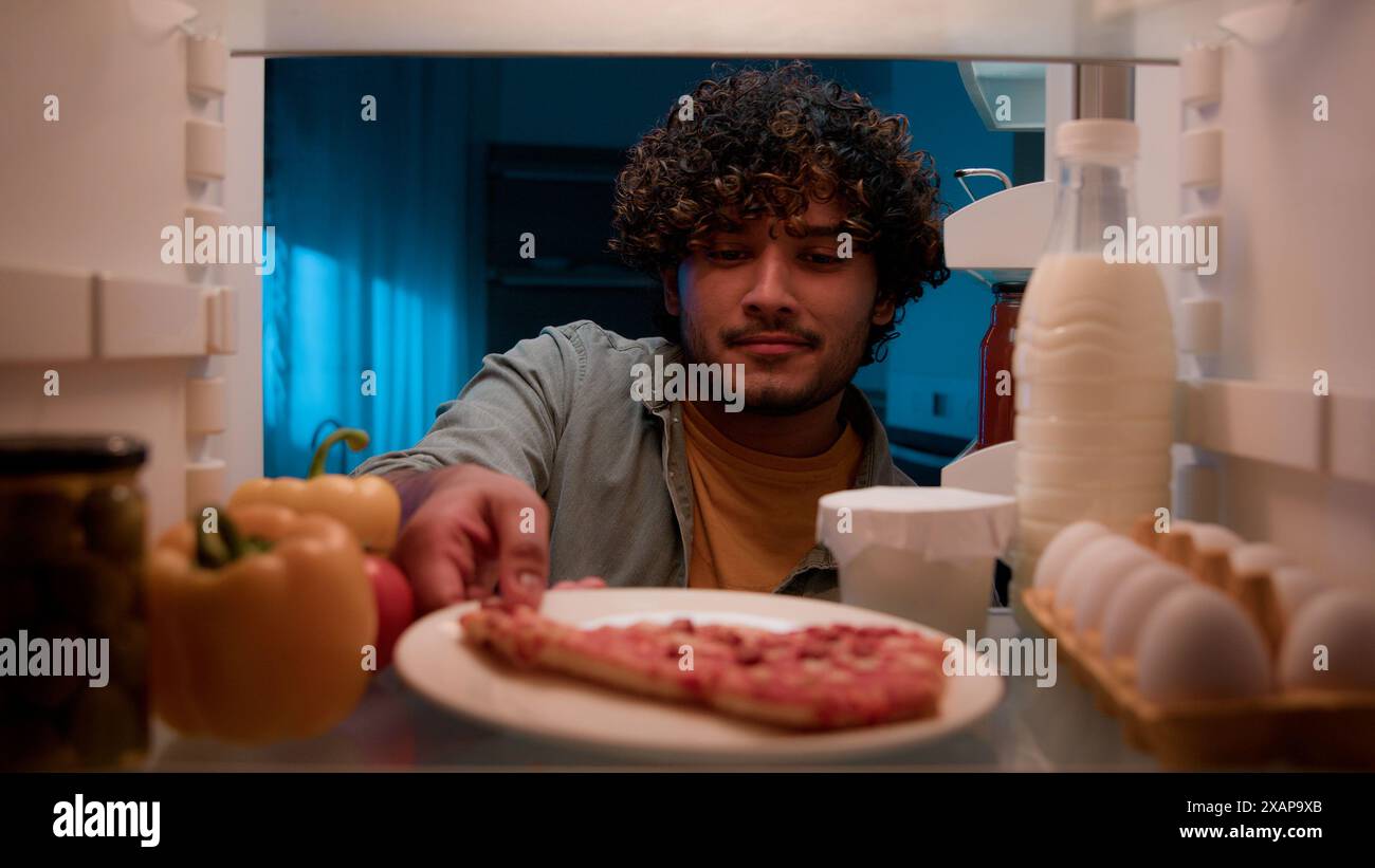 Man eating out refrigerator night hi-res stock photography and images ...