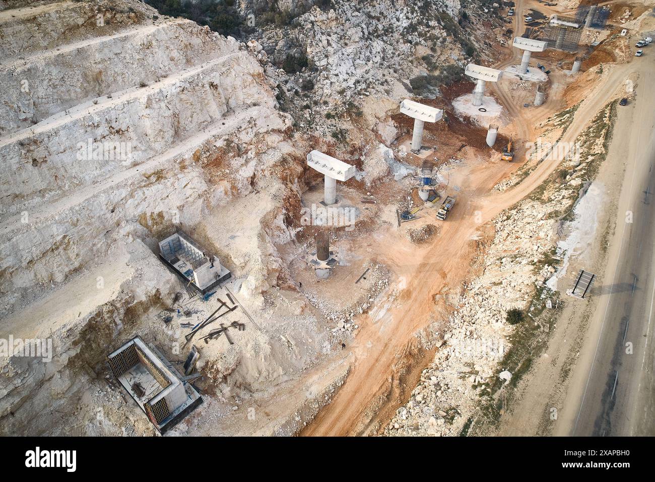 Ledges and slopes of highway under construction Stock Photo - Alamy