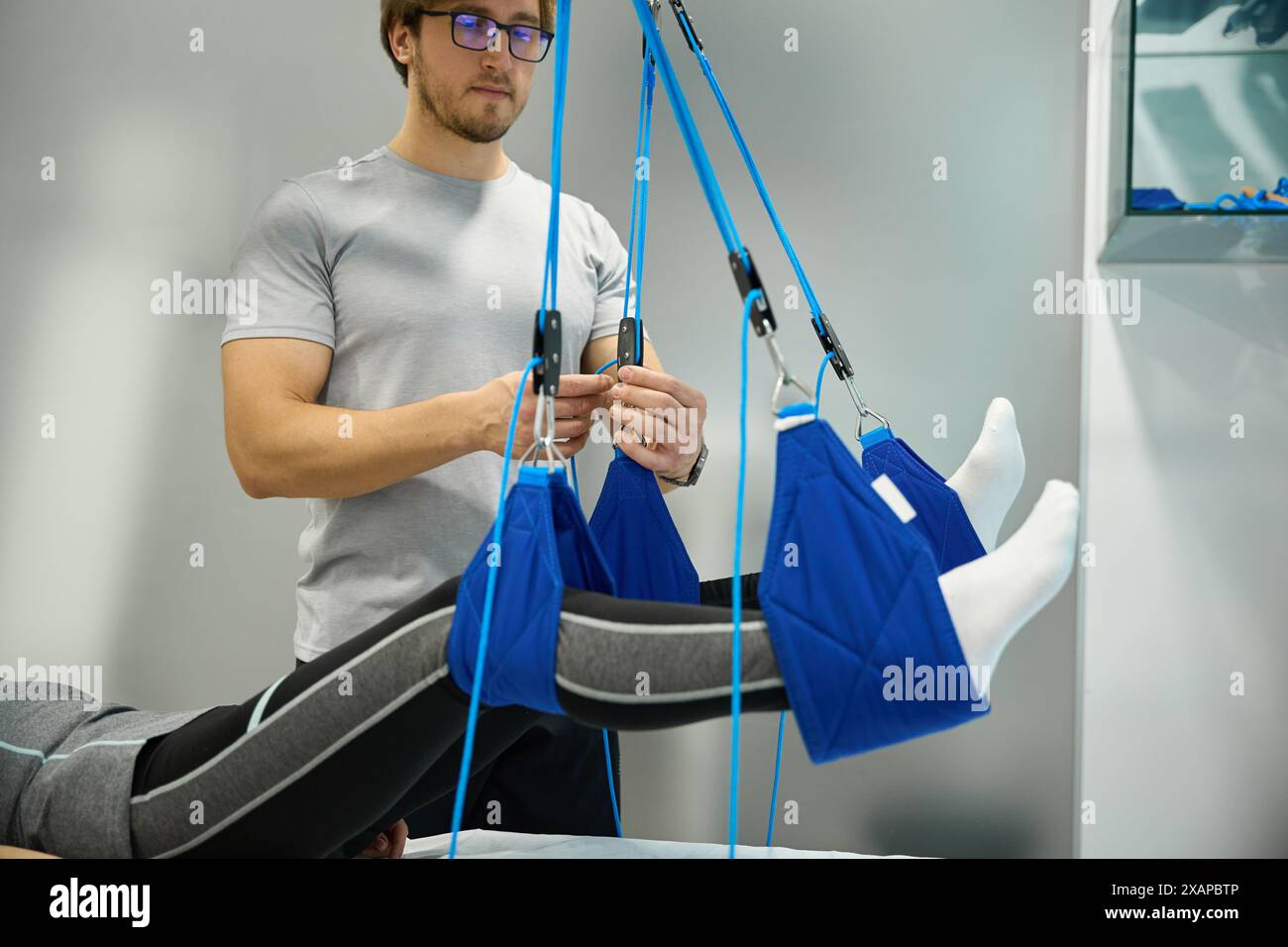 Specialist uses special fasteners on a suspension system Stock Photo ...