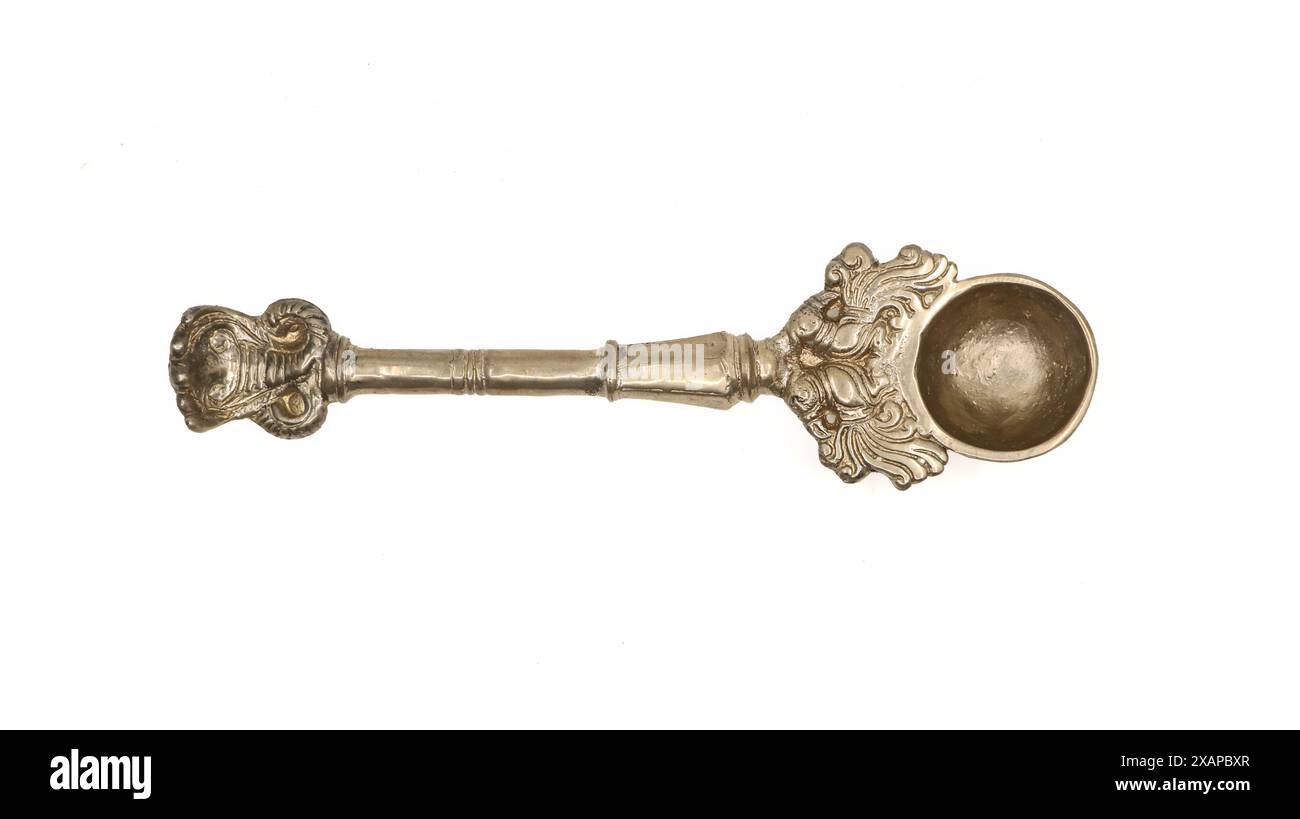 antique handcrafted bronze spoon used for pooja rituals isolated on ...