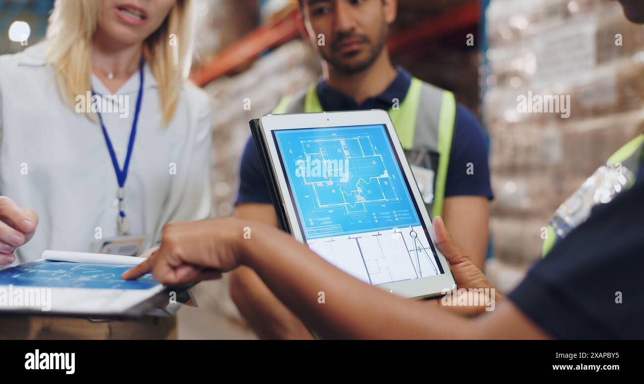 People, architect and tablet for blueprint in logistics warehouse for ...