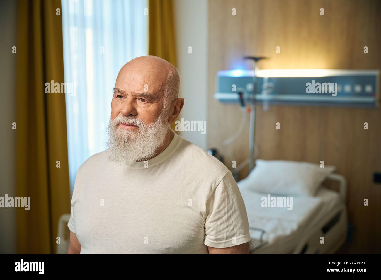 Adult grandfather stands in a hospital room Stock Photo - Alamy