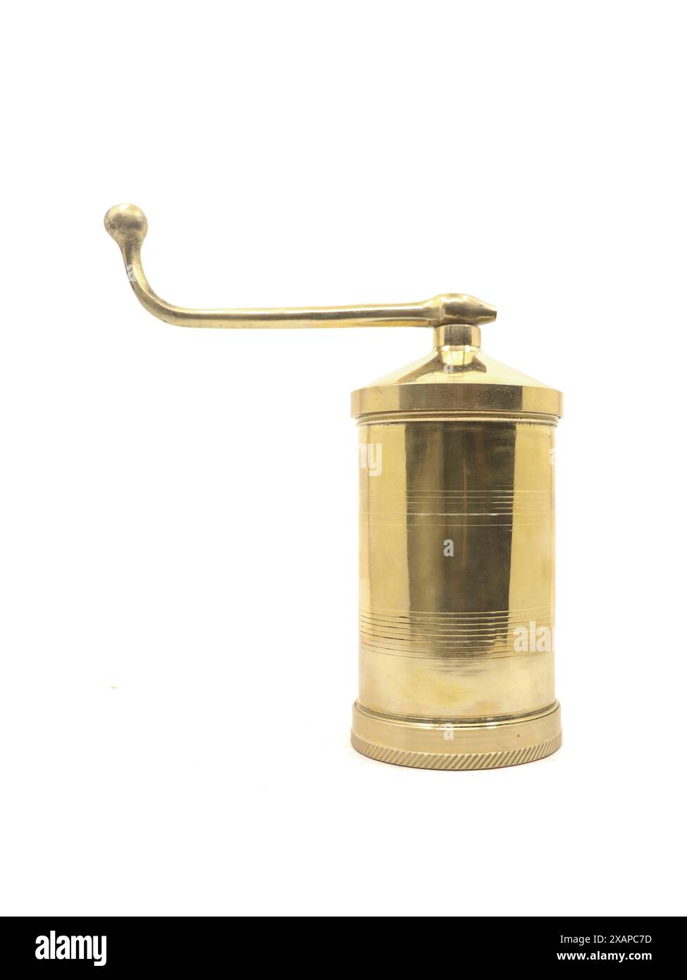 a golden idiyappam machine from india used to make appam isolated in a ...